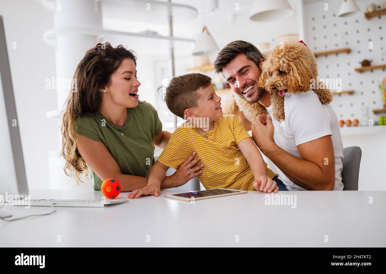 Happy family using technology devices together at home Stock Photo - Alamy