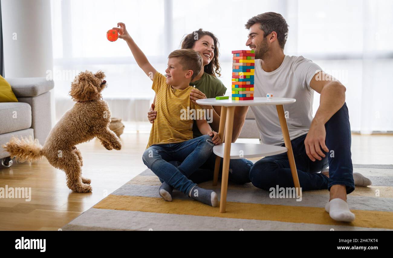 Happy young family having fun together at home. Happy childhood concept ...