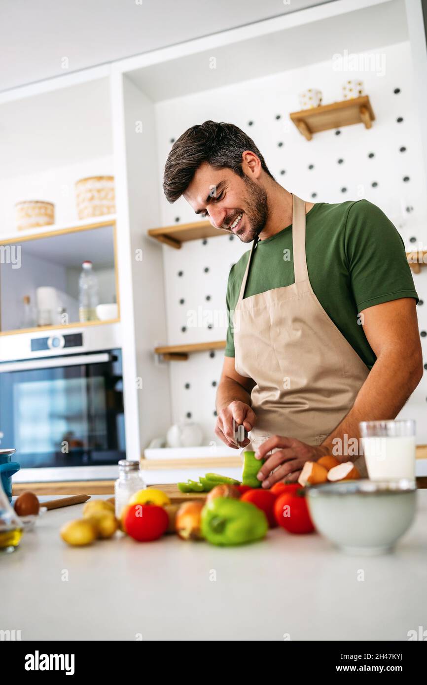 Young man at meal in kitchen hi-res stock photography and images - Alamy