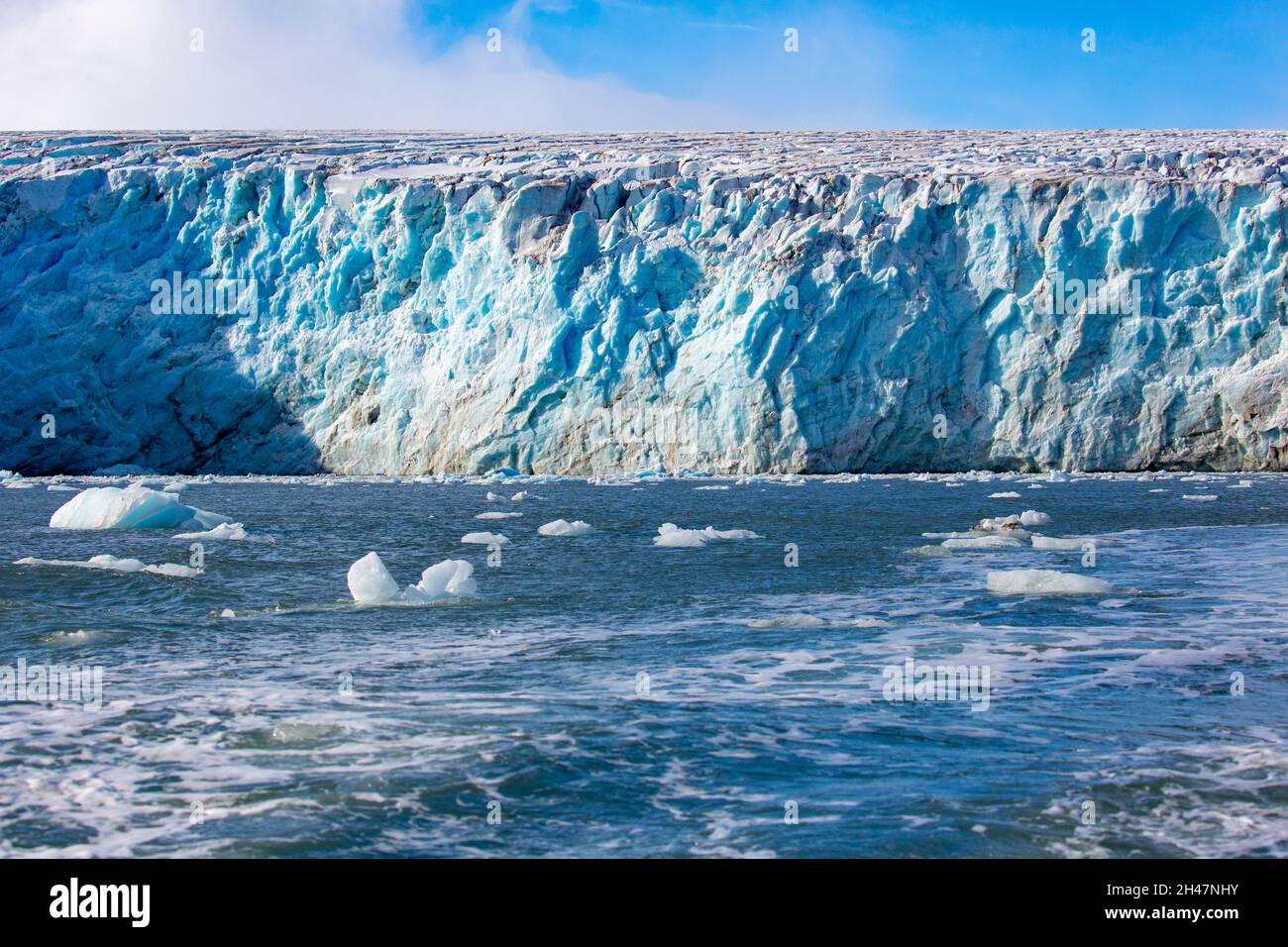 Blue ice of a glacier in Antarctica. The ice of blue icebergs contains ...
