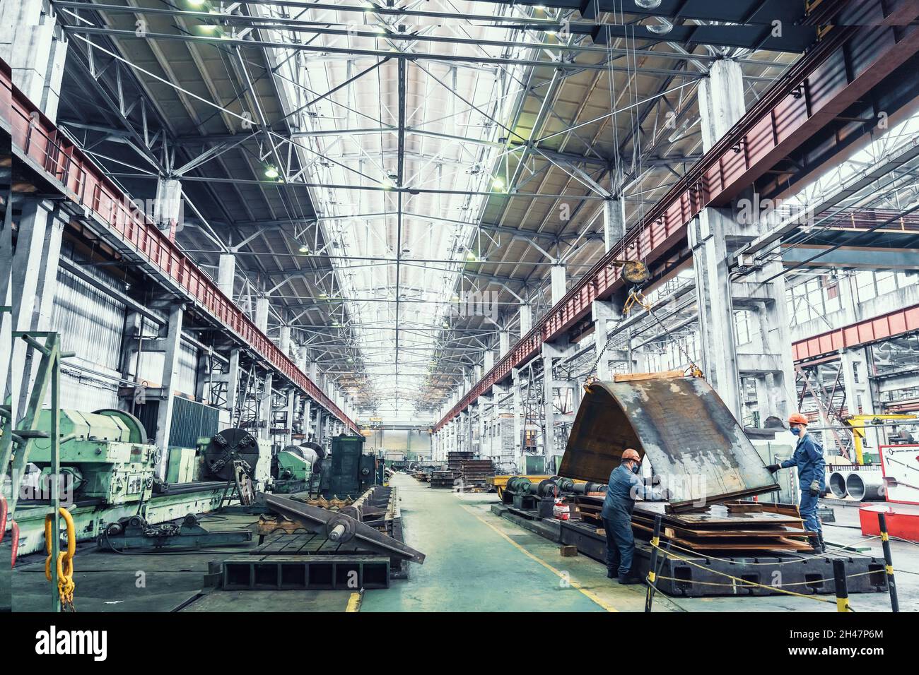 Metallurgical plant interior. Large workshop with metalworking machines ...