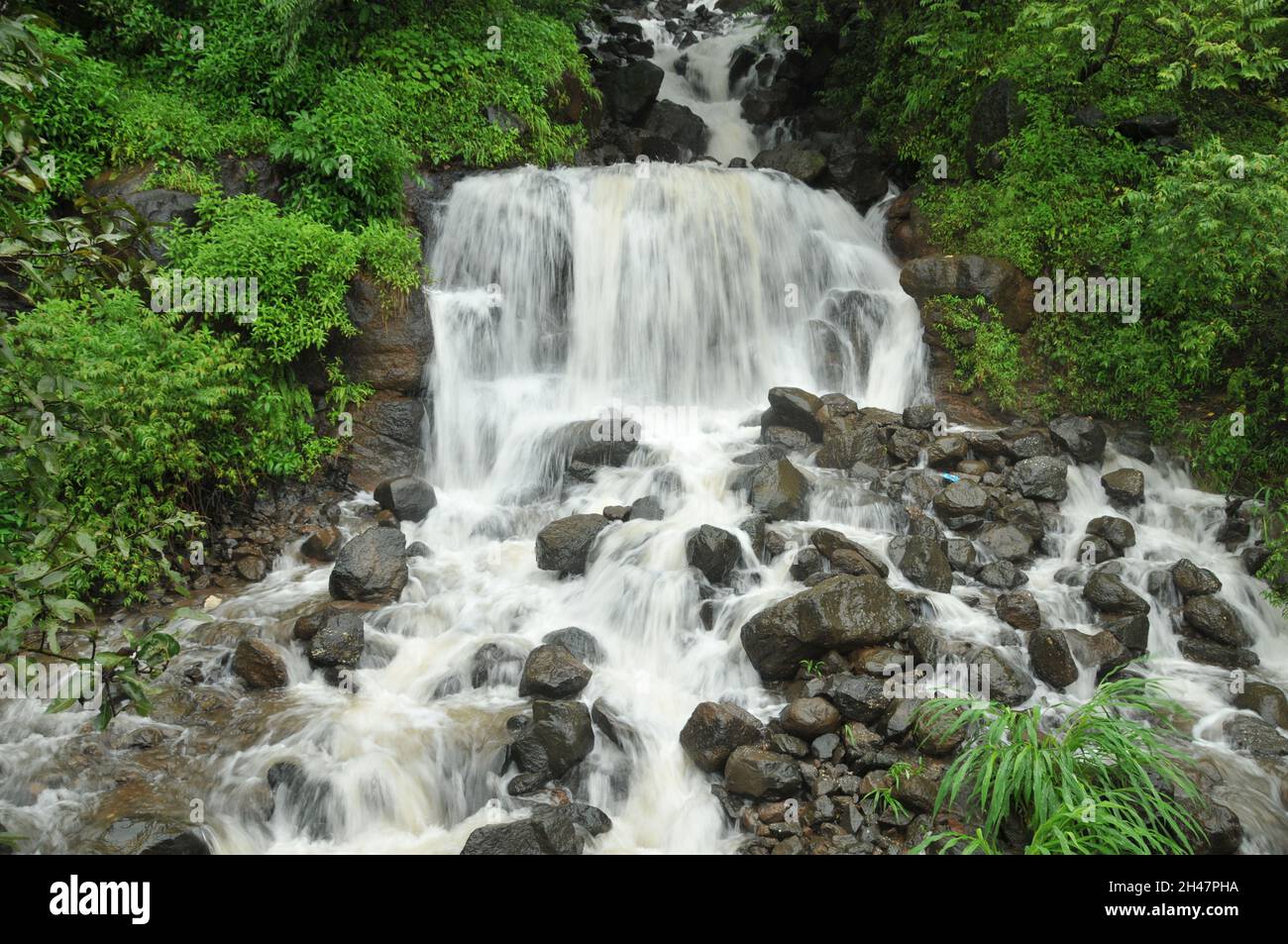 Scenic waterfall on the way to Murud-Janjira tourist spot in Raigad ...