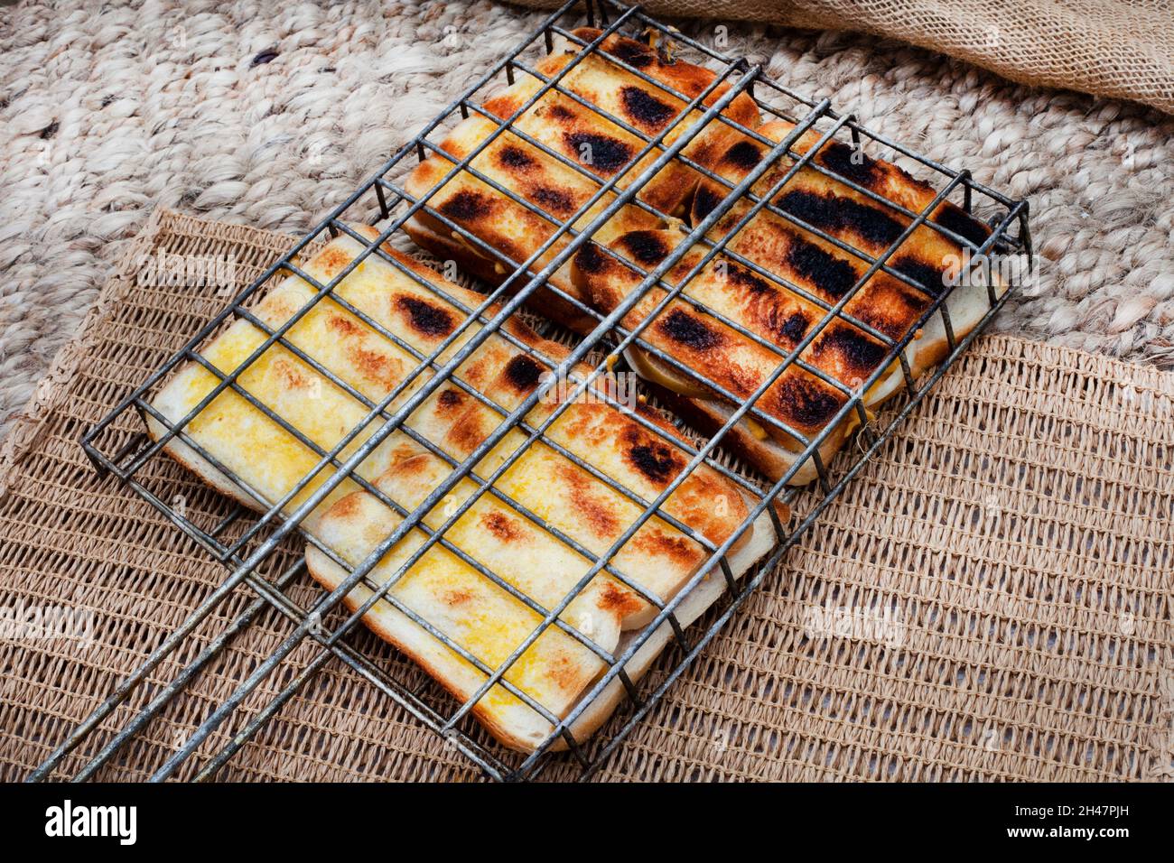 Traditional South African braai Bread with cheese, onion and tomato ...
