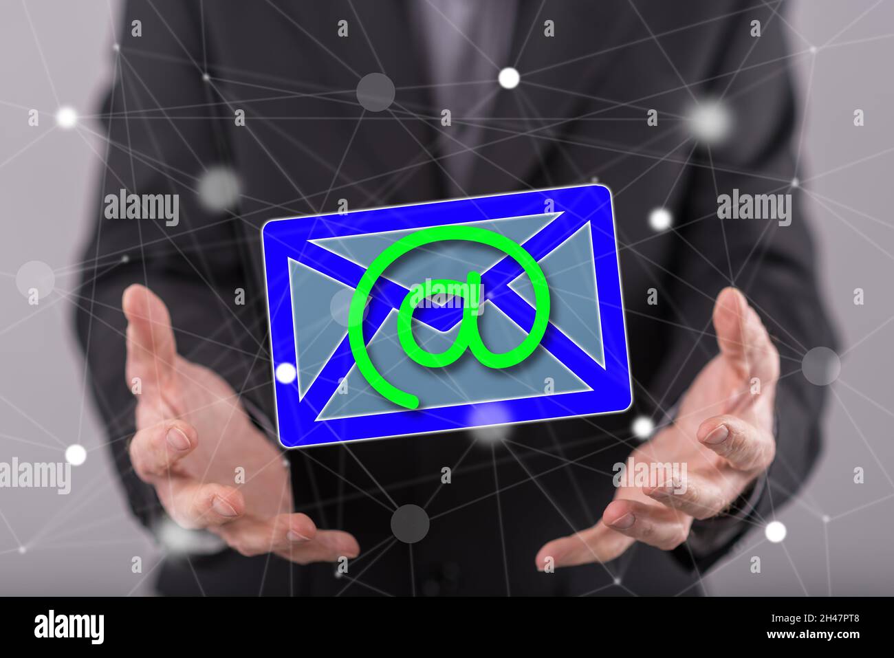 E-mail concept above the hands of a man in background Stock Photo - Alamy