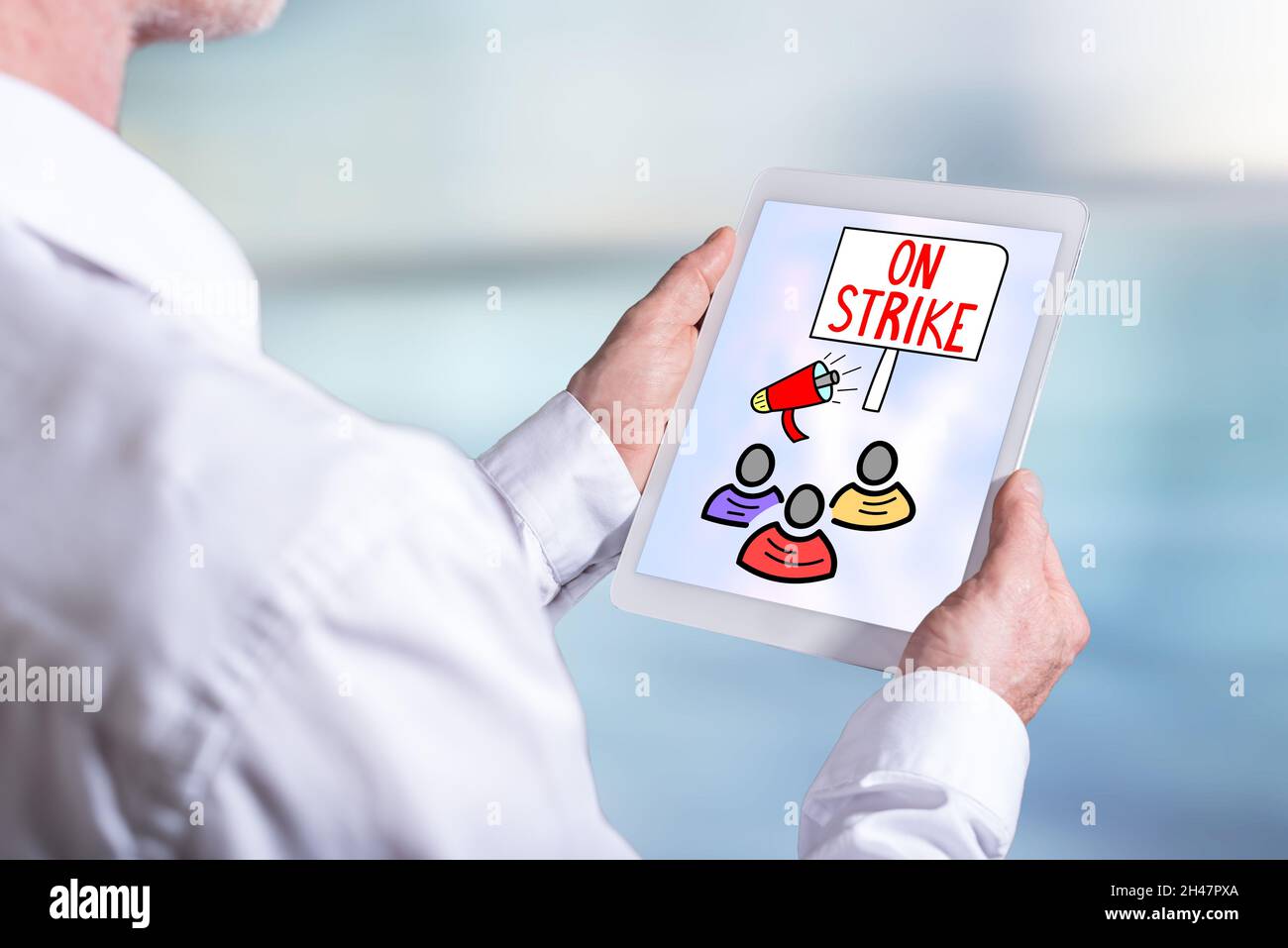Tablet screen displaying an on strike concept Stock Photo - Alamy