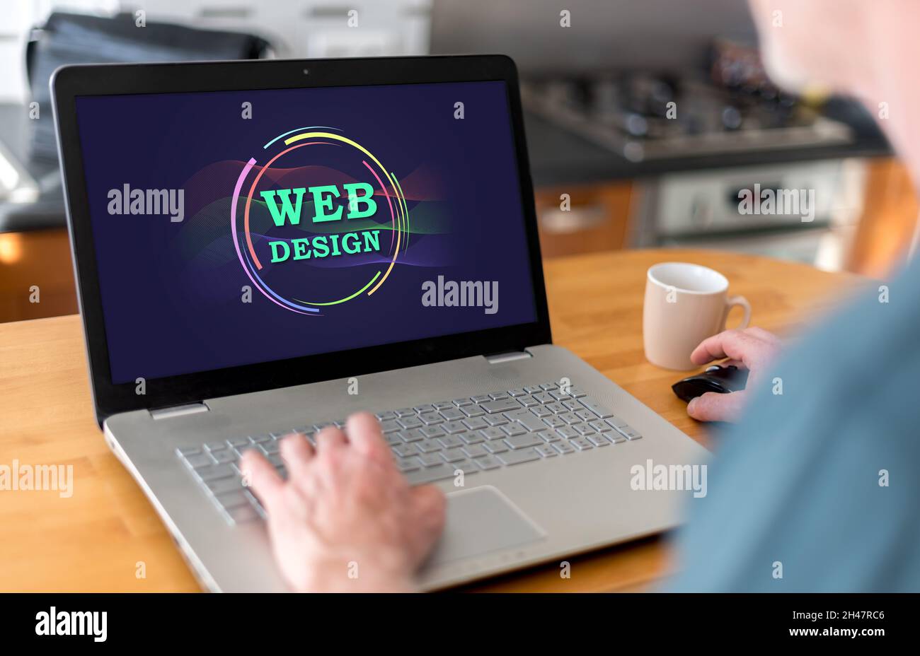 Man using a laptop with web design concept on the screen Stock Photo ...