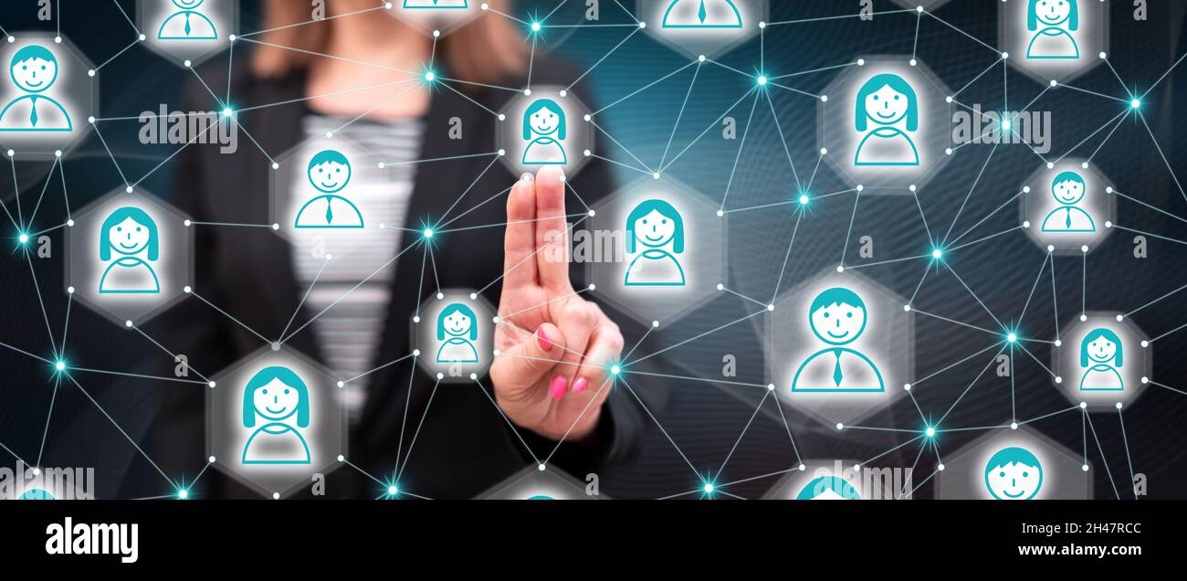 Woman touching a social network concept on a touch screen with her ...