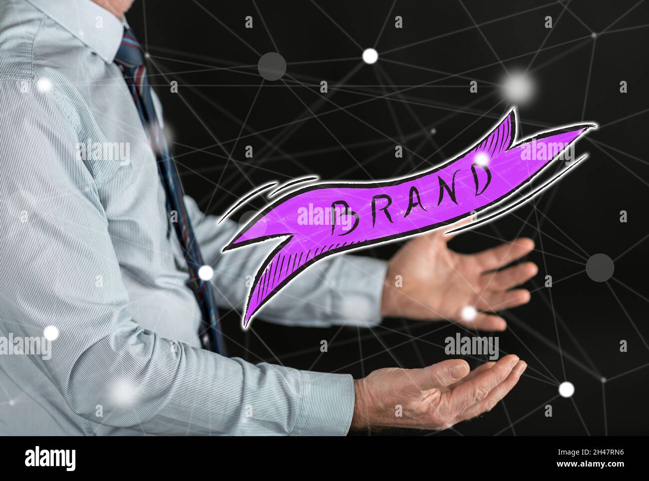 Brand concept above the hands of a man Stock Photo - Alamy