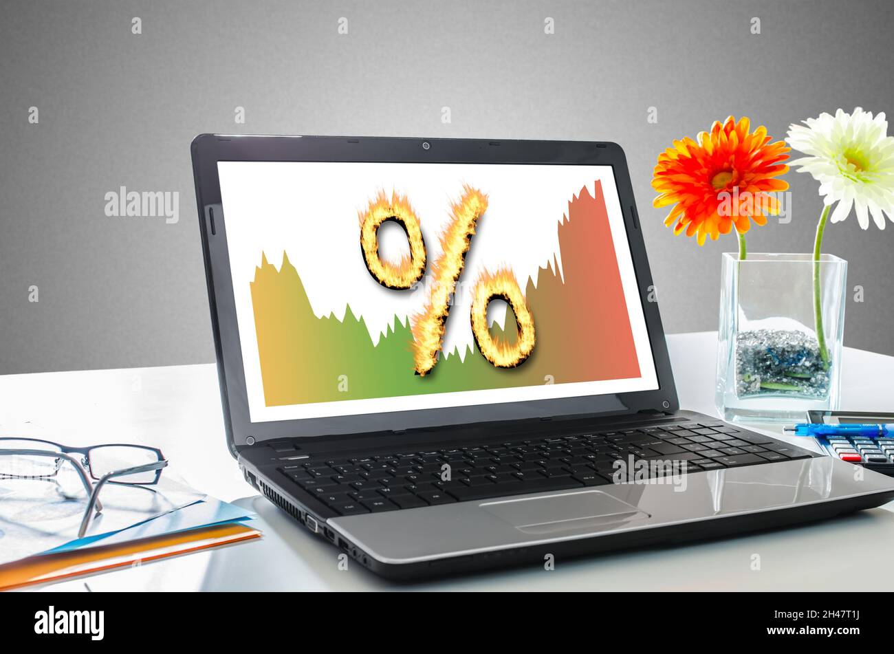 Laptop screen showing interest rates concept Stock Photo - Alamy