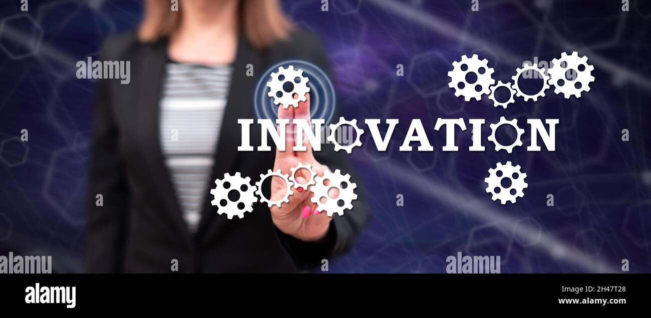 Woman touching an innovation concept on a touch screen with her fingers ...