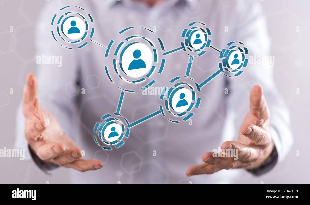 Social media and teamwork concept above the hands of a man in ...