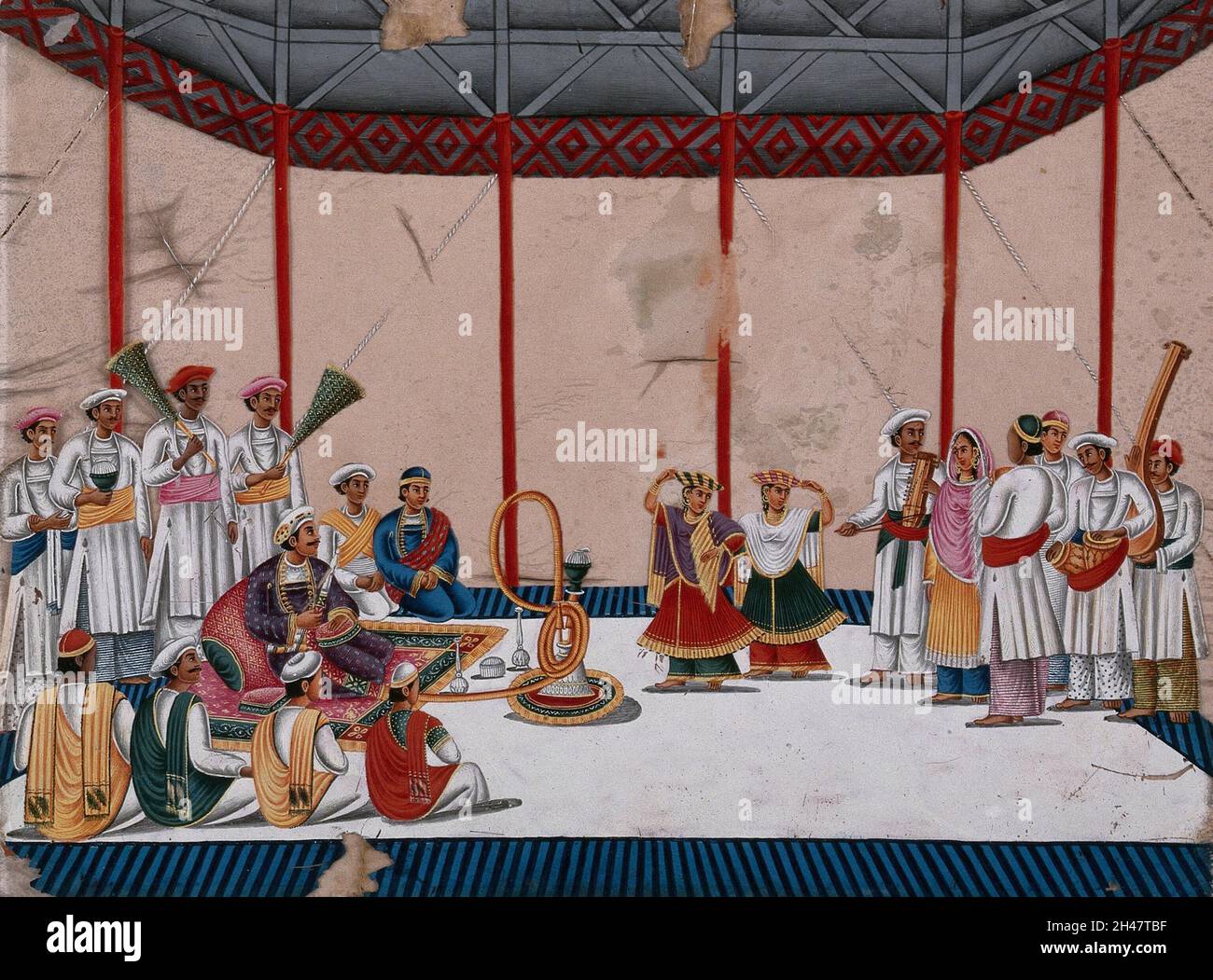 A high ranking man smoking a hookah pipe and watching the musicians and ...