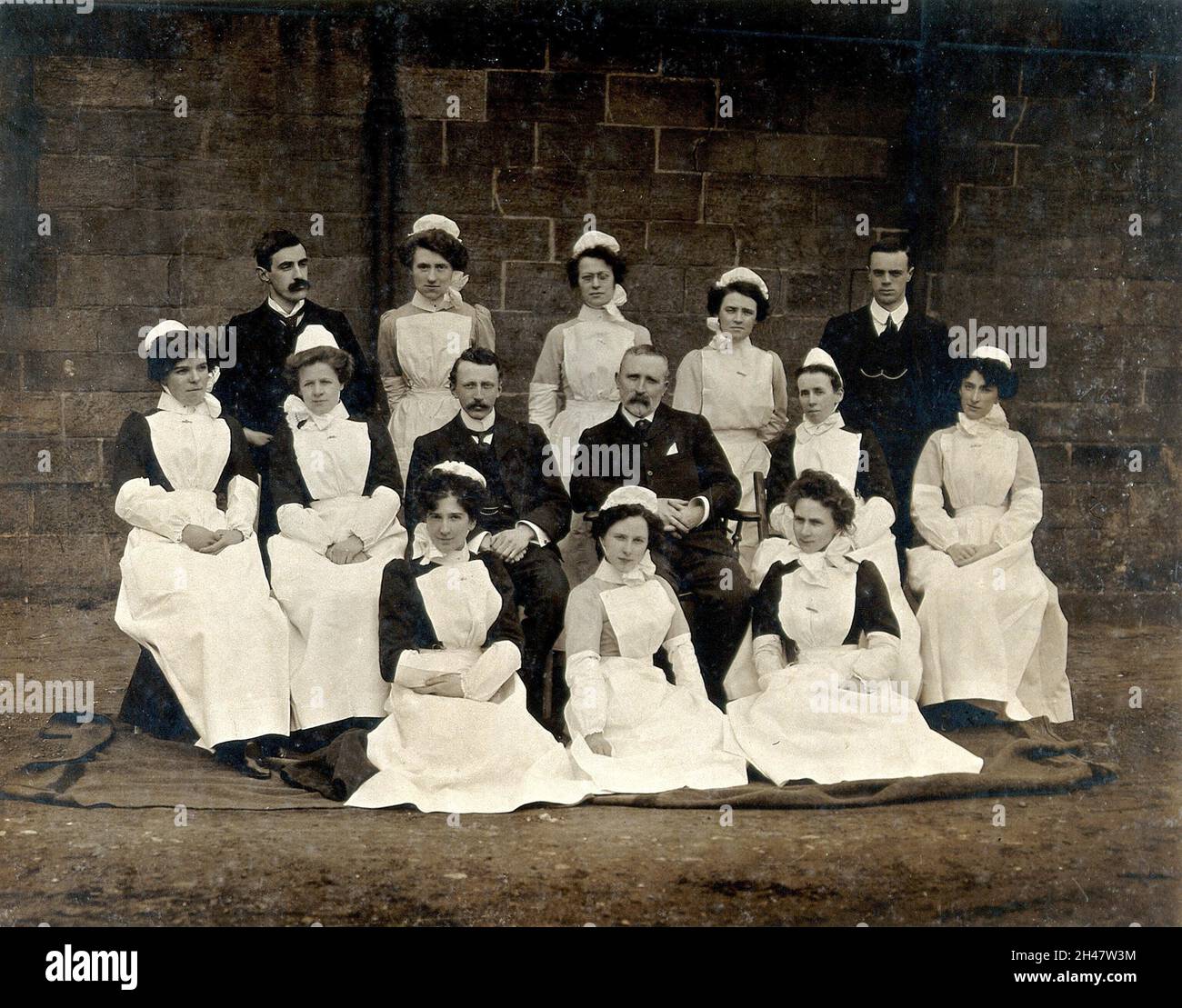 James Rutherford Morison with his staff: three men and ten women ...