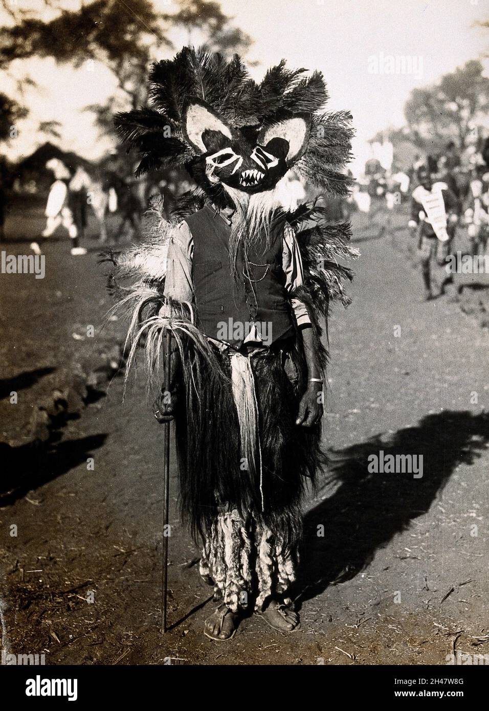 Serowe, Botswana: an African devil dancer wearing a headdress. Albumen ...