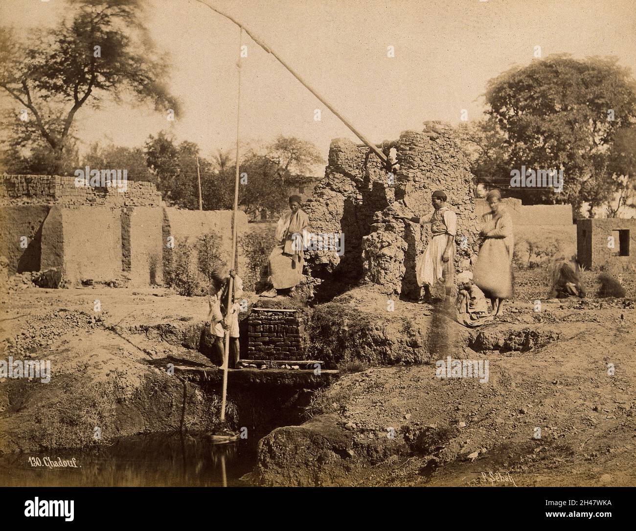 A shaduf, or water crane, North Africa: men are shown operating the ...