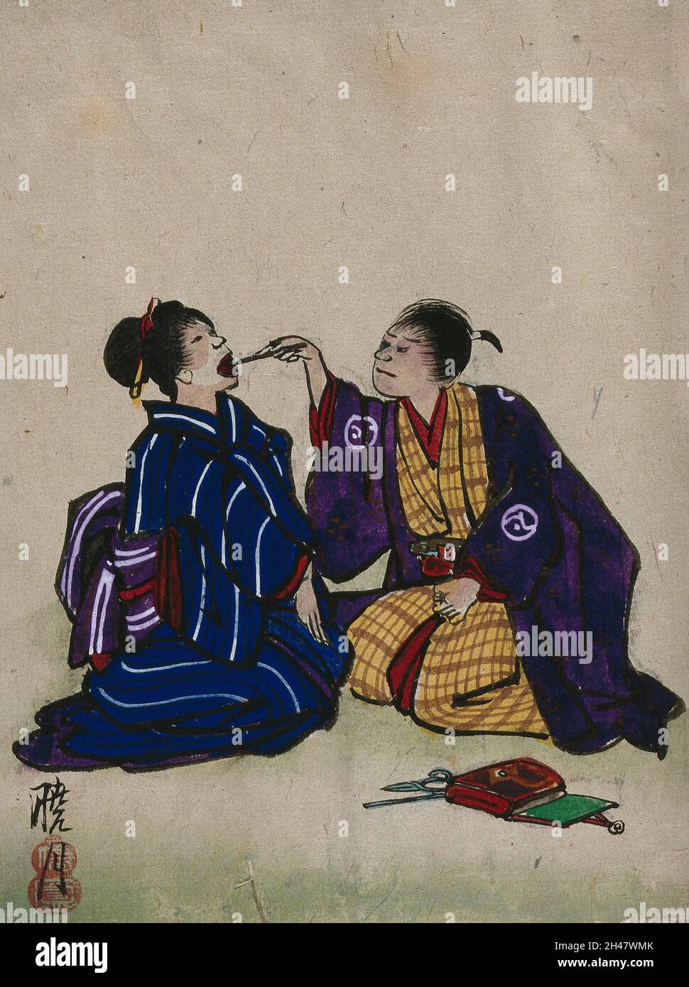 A doctor examining a woman's mouth; doctor and patient are kneeling on ...
