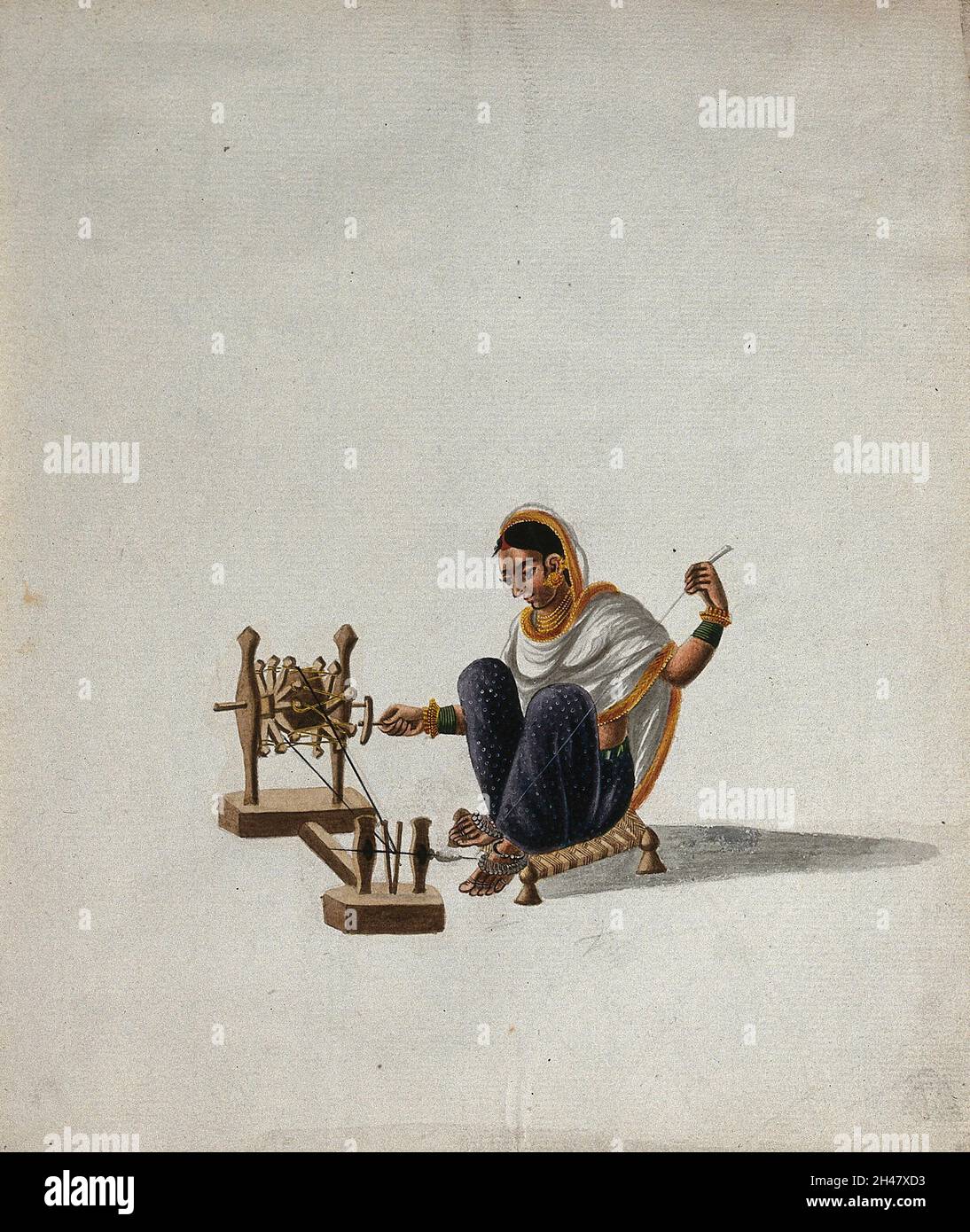 A woman sitting on a low stool and spinning thread. Gouache painting by ...