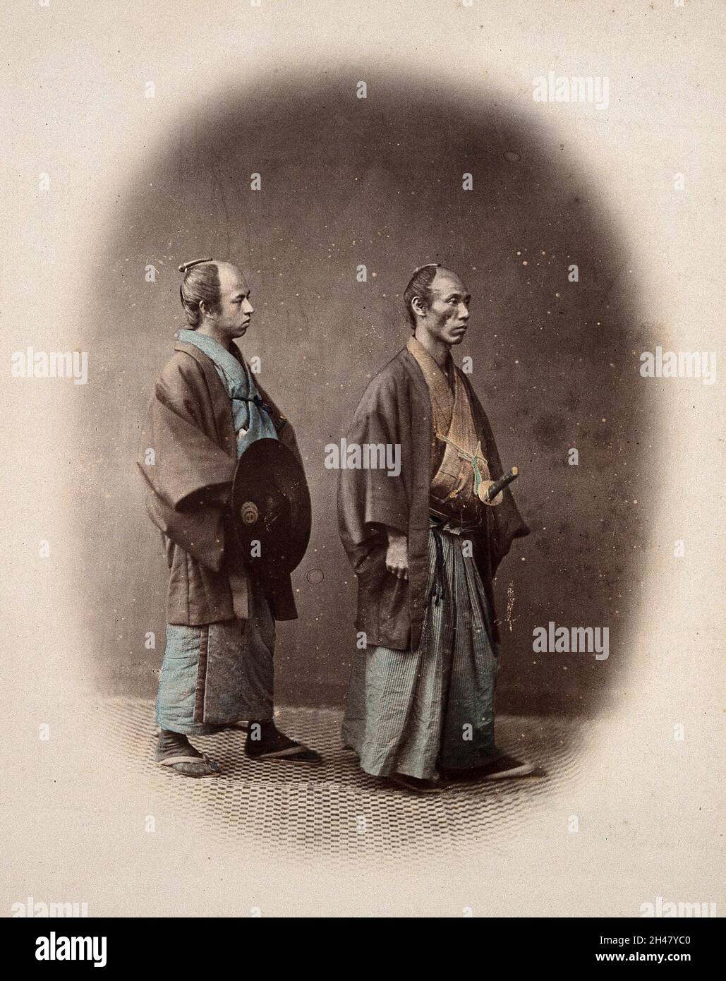 Japan: two samurai in traditional robes with swords. Coloured ...
