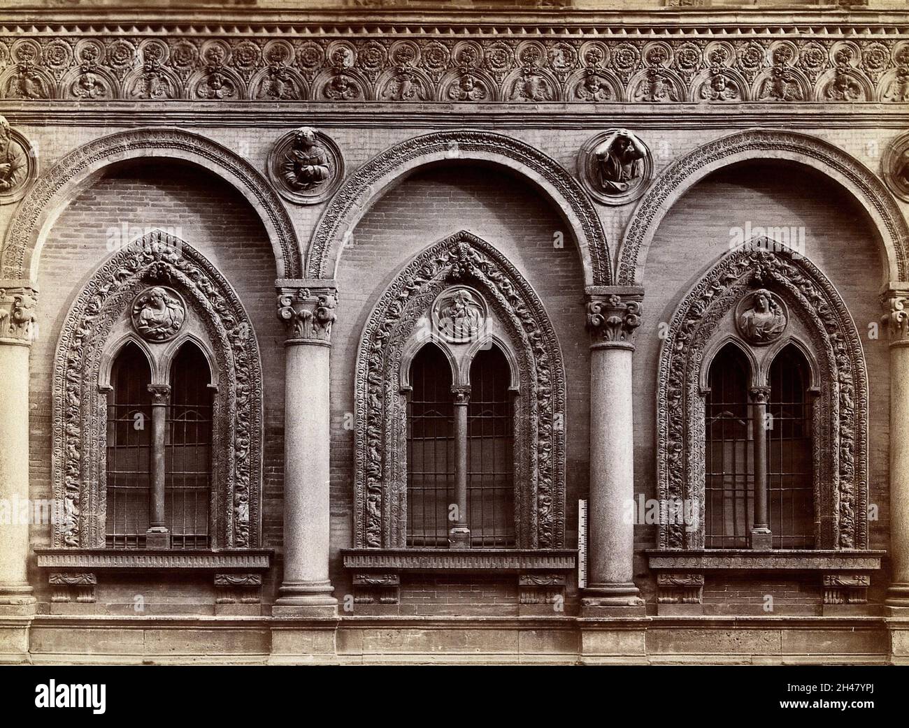 Ospedale Maggiore, Milan: three windows carved with relief sculpture ...