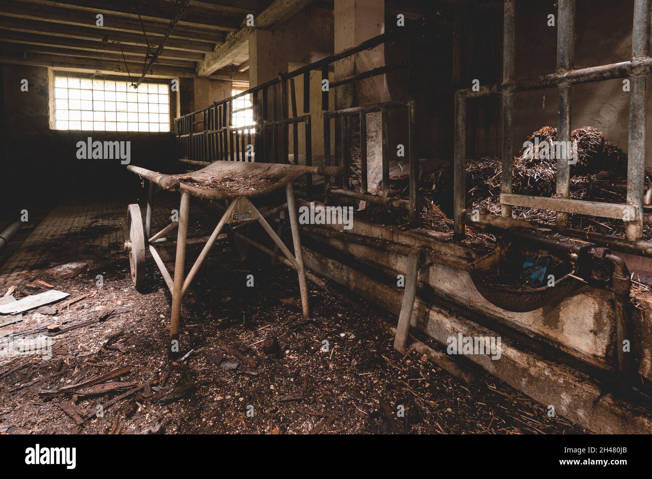 An old, collapsed hay barn, an abandoned farm, lost and decayed ...