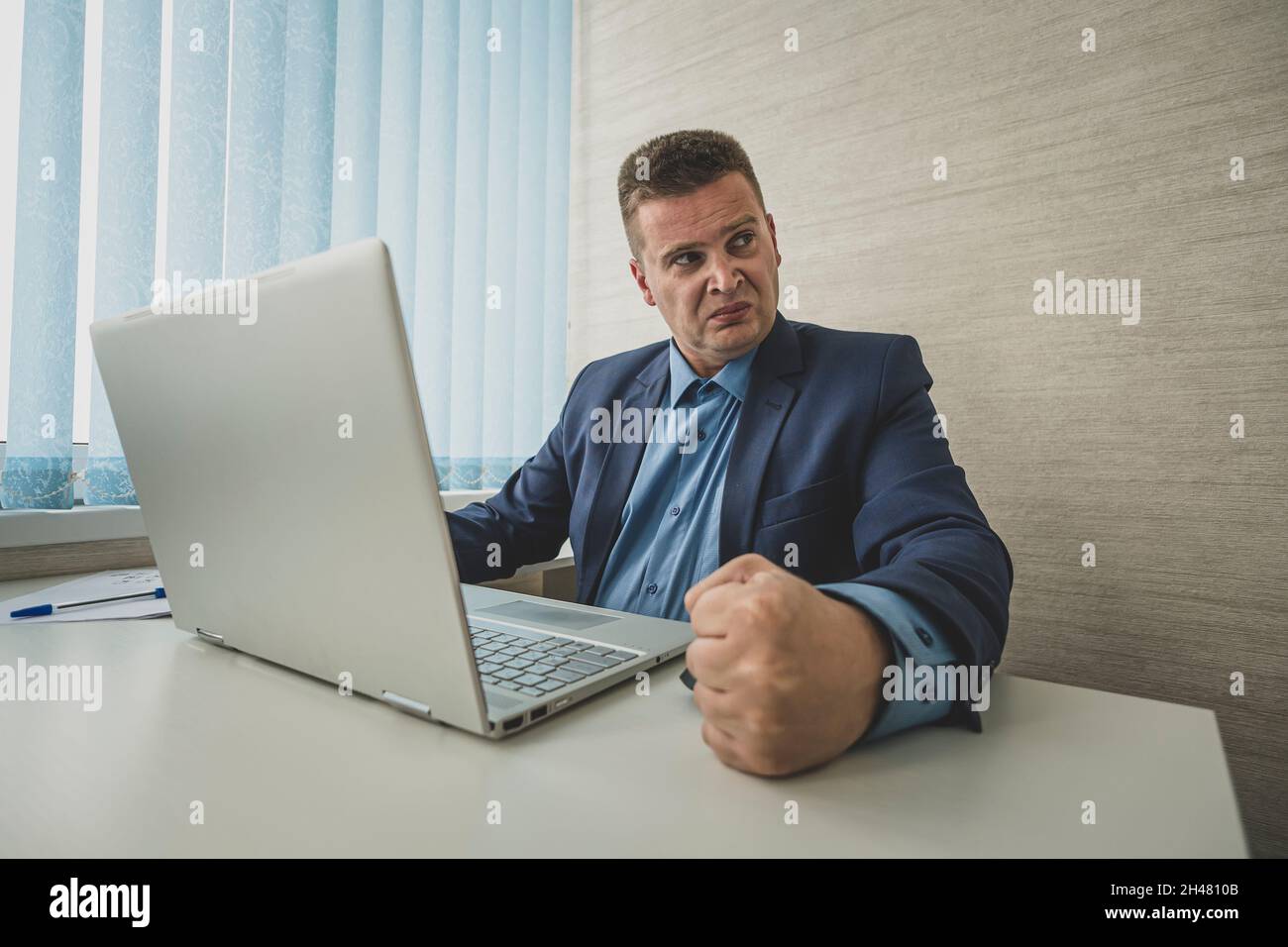 Angry man hits the table with his fist. Concept of anger. angry ...