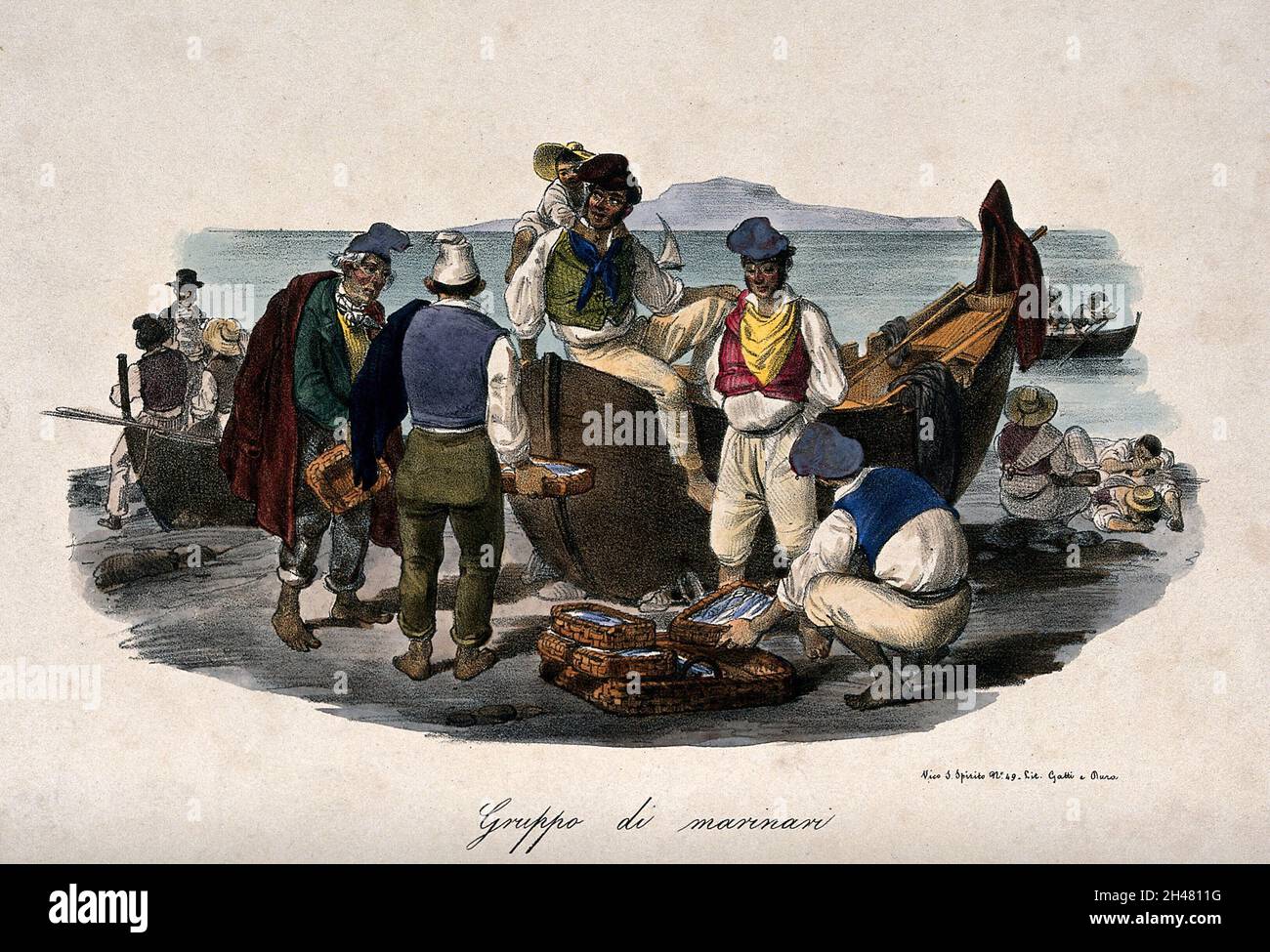 Fisherman are on the sea shore with the boat from which they have ...
