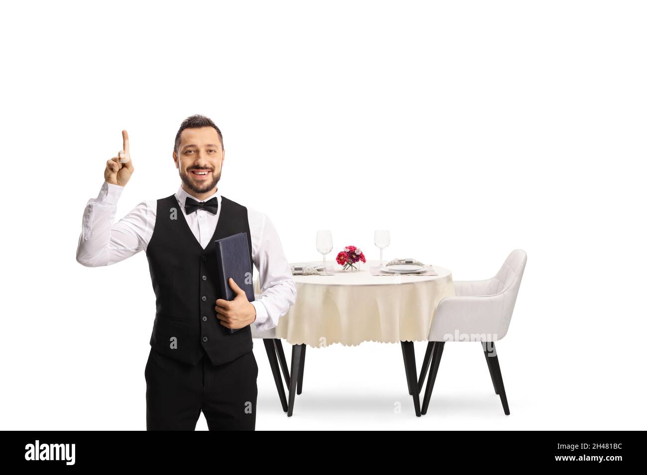 Waiter in front of a table holding a menu list and pointing up isolated ...