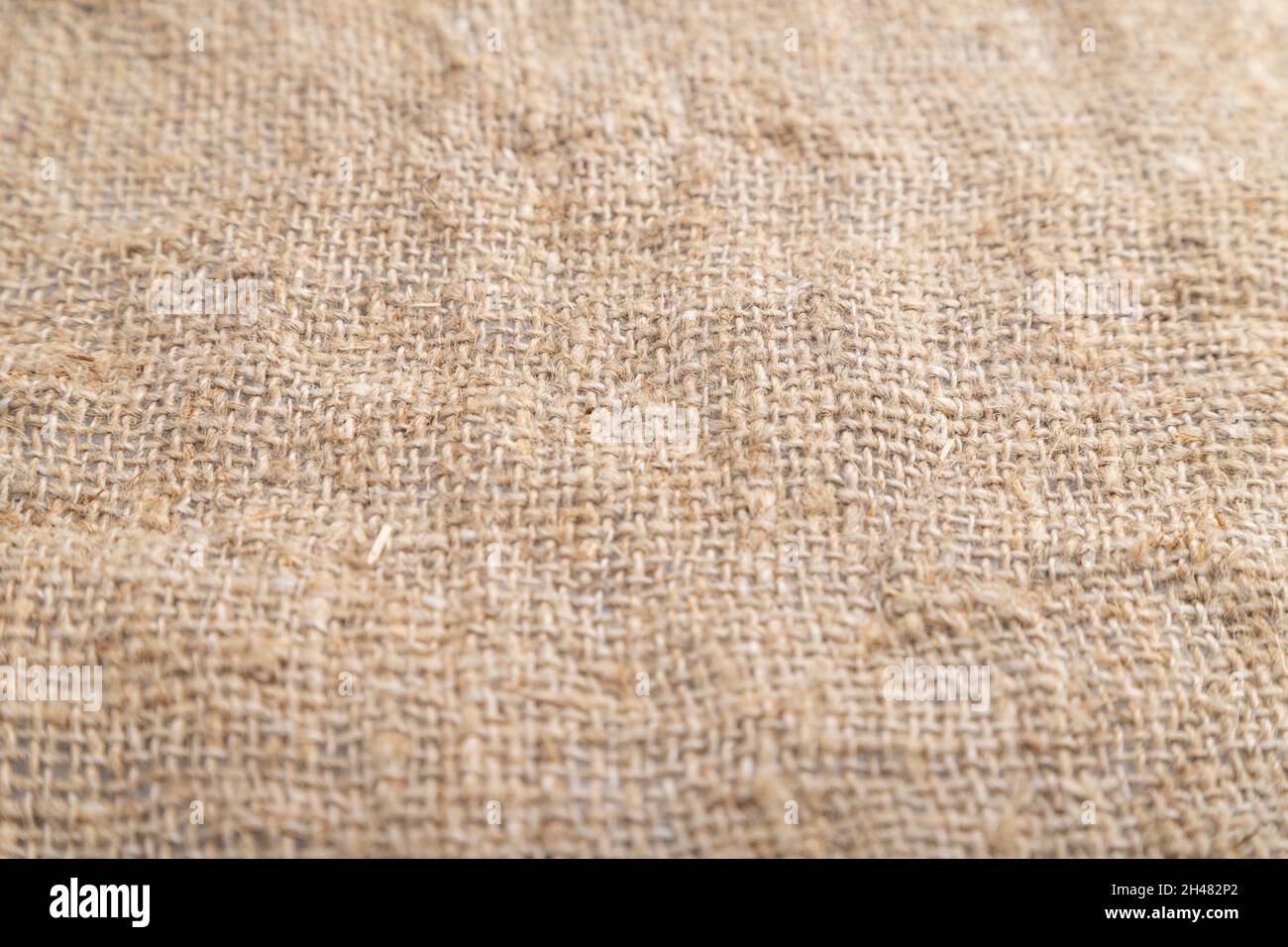 Fragment of smooth brown linen tissue. Side view, natural textile ...