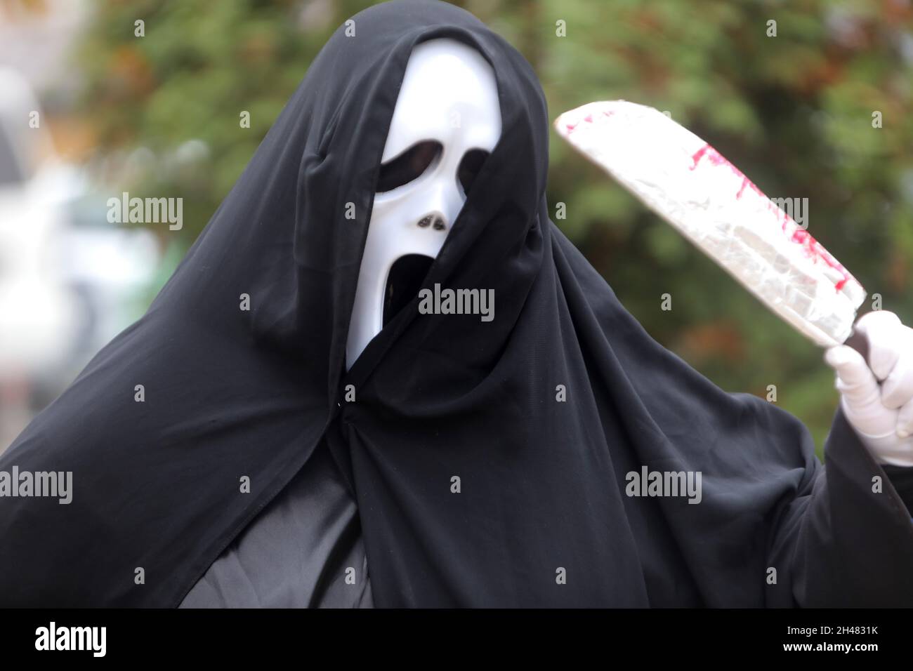 KYIV, UKRAINE - OCTOBER 30, 2021 - A person in the Ghostface costume ...