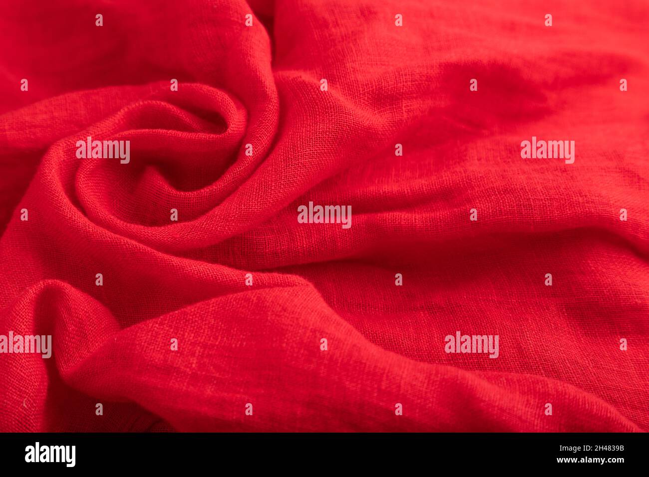 Fragment of red silk tissue. Side view, natural textile background and ...