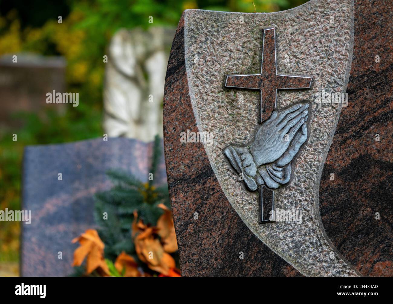 Trier, Germany. 01st Nov, 2021. Praying hands adorn a gravestone at ...