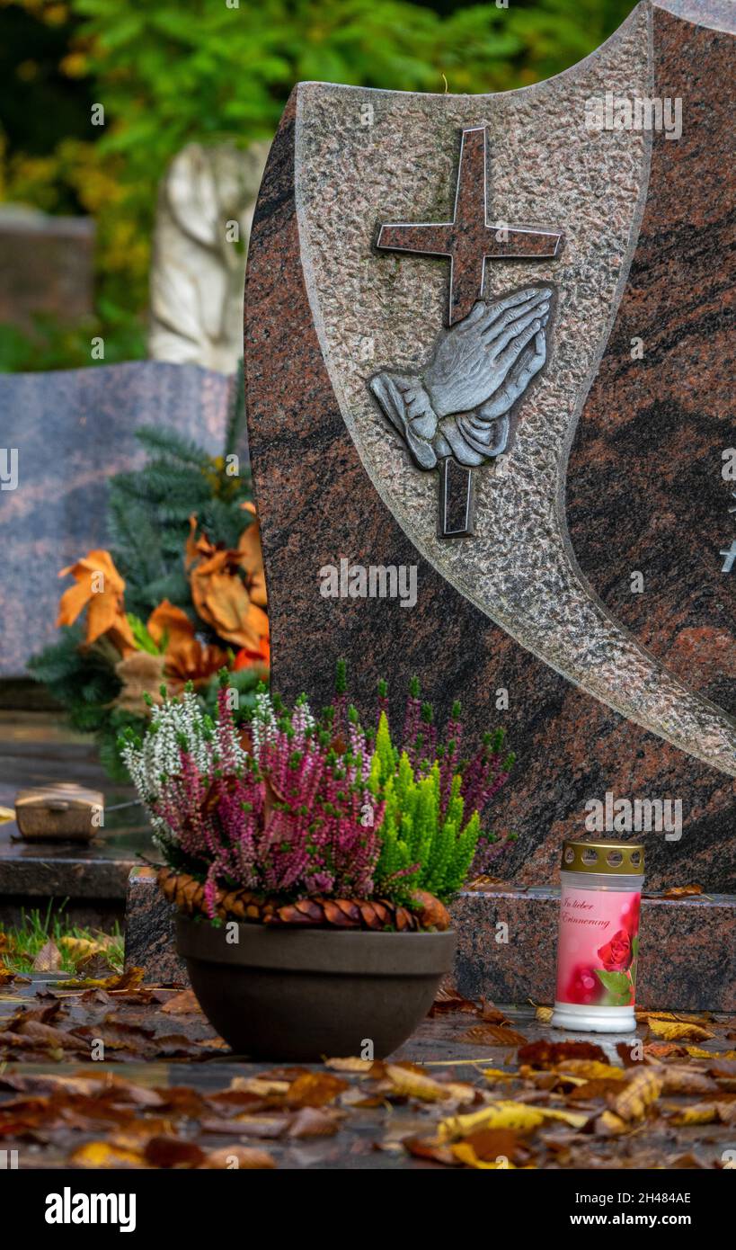 Trier, Germany. 01st Nov, 2021. Praying hands adorn a gravestone at ...