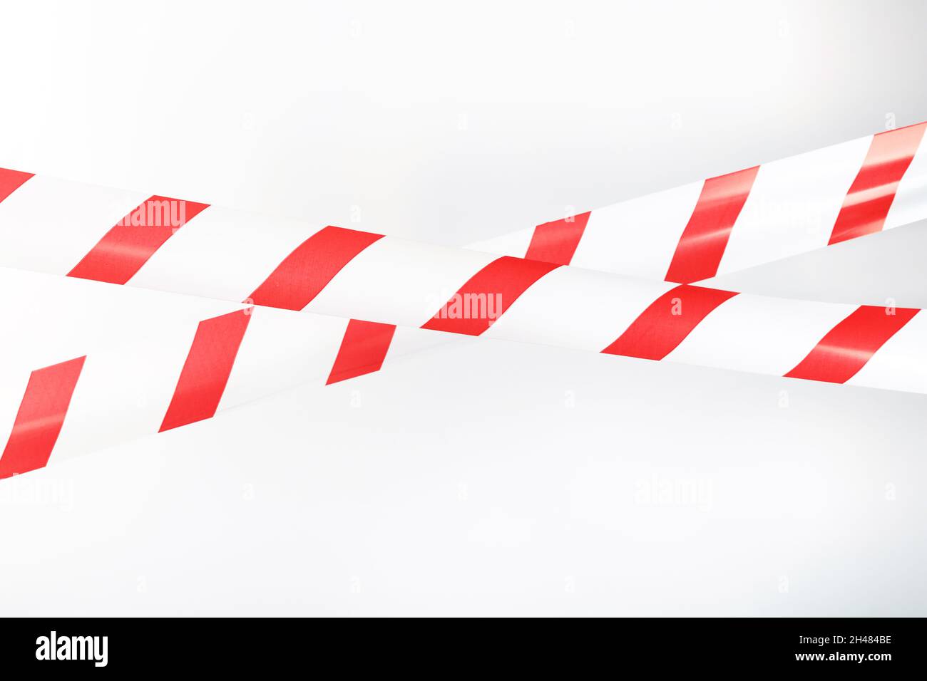Red and white striped fencing tape on a white background. Tapes for ...
