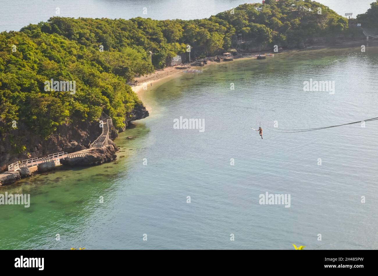 Person on the zip line at the scenic Hundred Islands National Park in ...