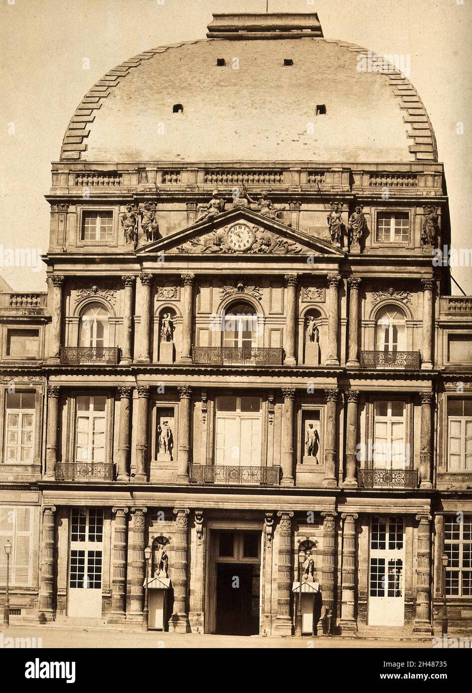 The Louvre, Paris, France: building decorated with ornate pillars and ...