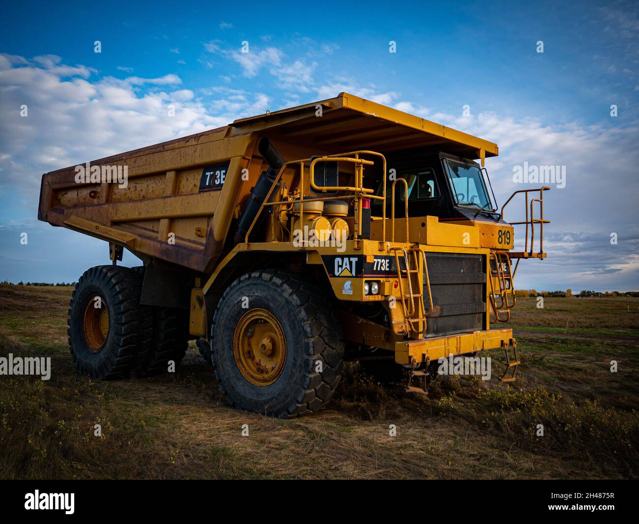AIRDRIE, CANADA - Oct 04, 2021: Yellow CAT heavy equipment truck in a ...