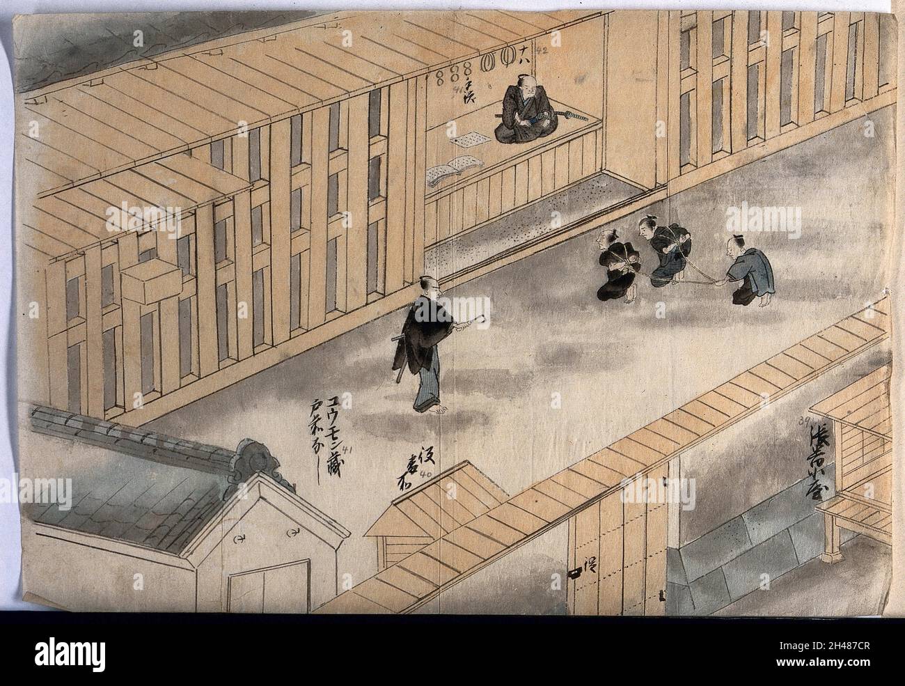 Two Japanese prisoners are forced to kneel before a high ranking ...