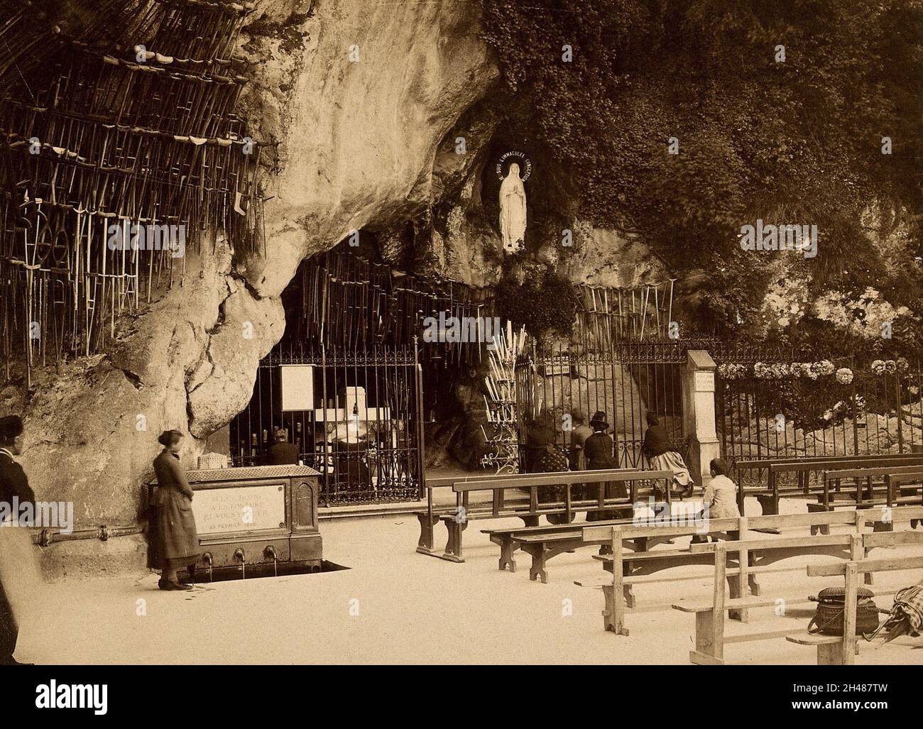 Lourdes, France: the Grotto of Our Lady of Lourdes: pilgrims at the ...