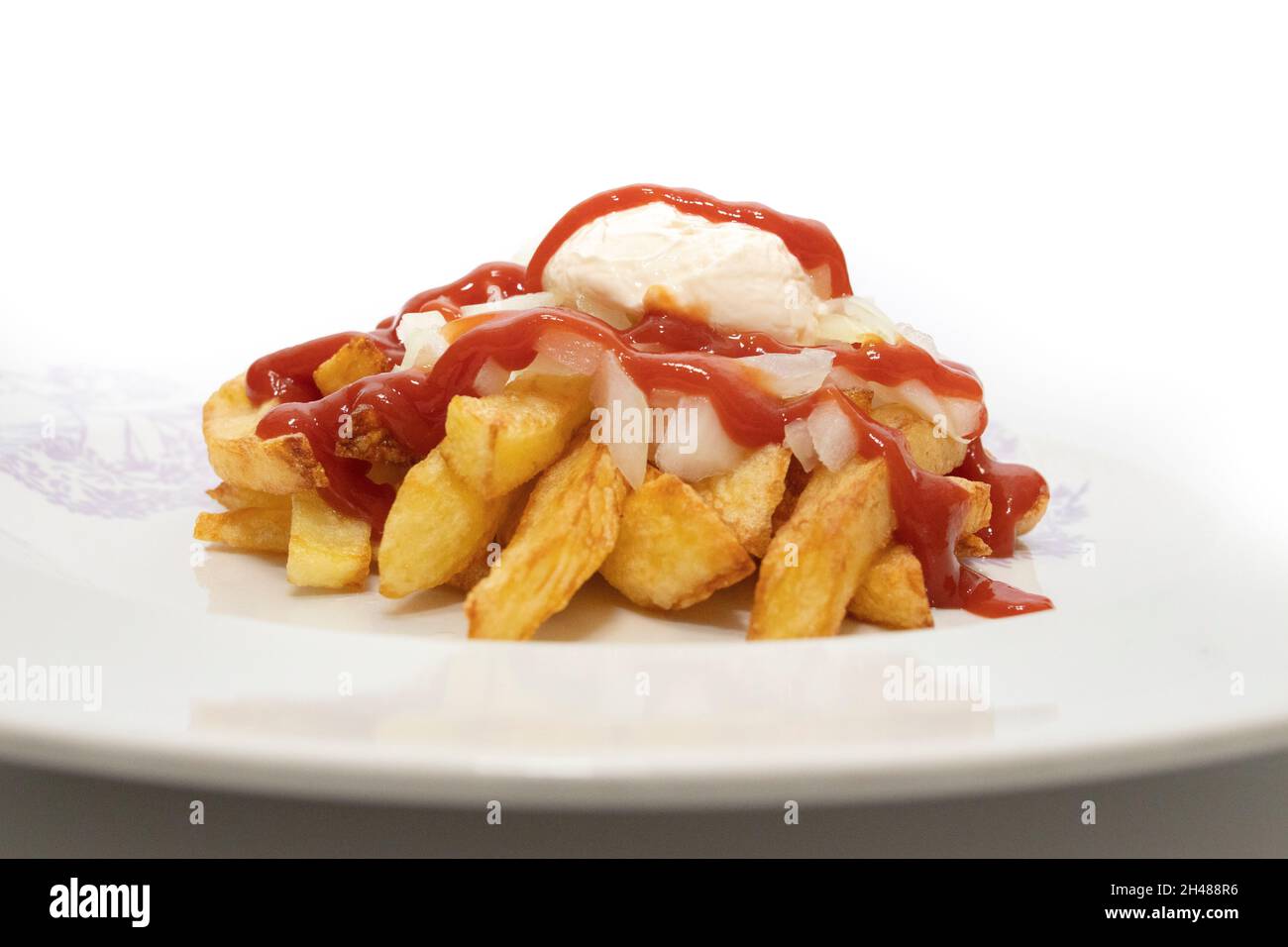 Frites spezial with mayonnaise, ketchup and onions, isolated on a white ...