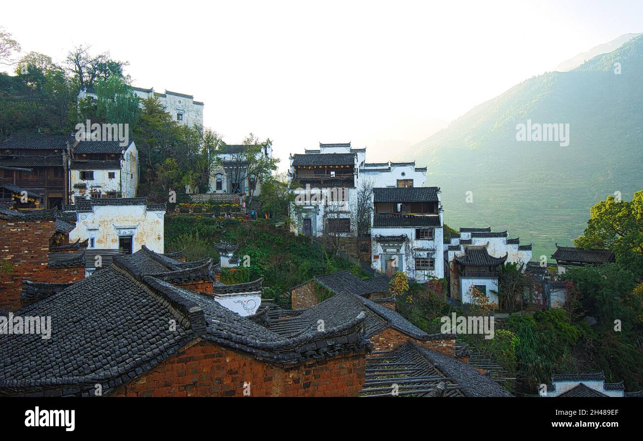 Gray roofs with white or brown walls. Ancient buildings in Huangling ...