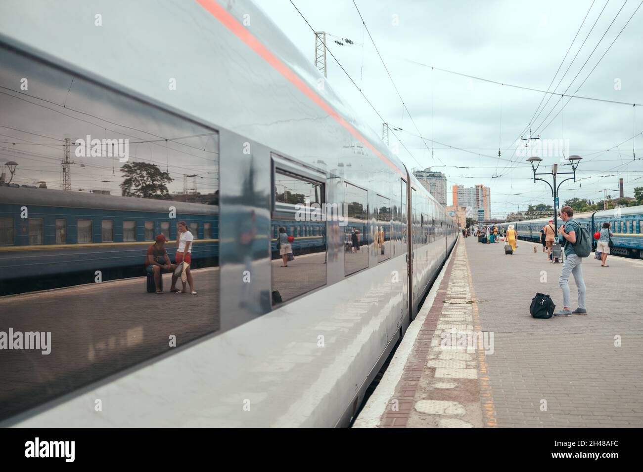 Modern train at empty platform of railway station. Traveling concept ...