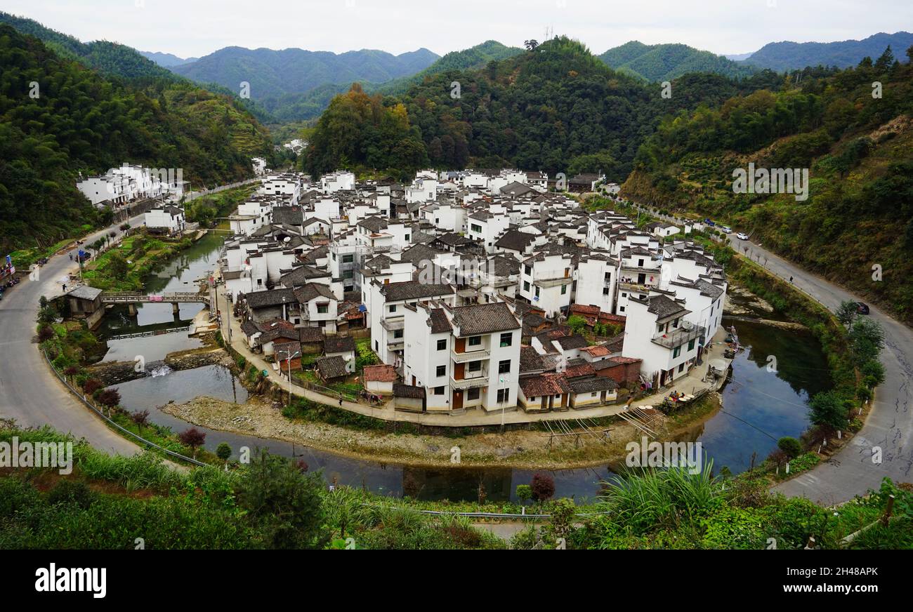 The river is in a large semicircle, surrounded by high mountains ...