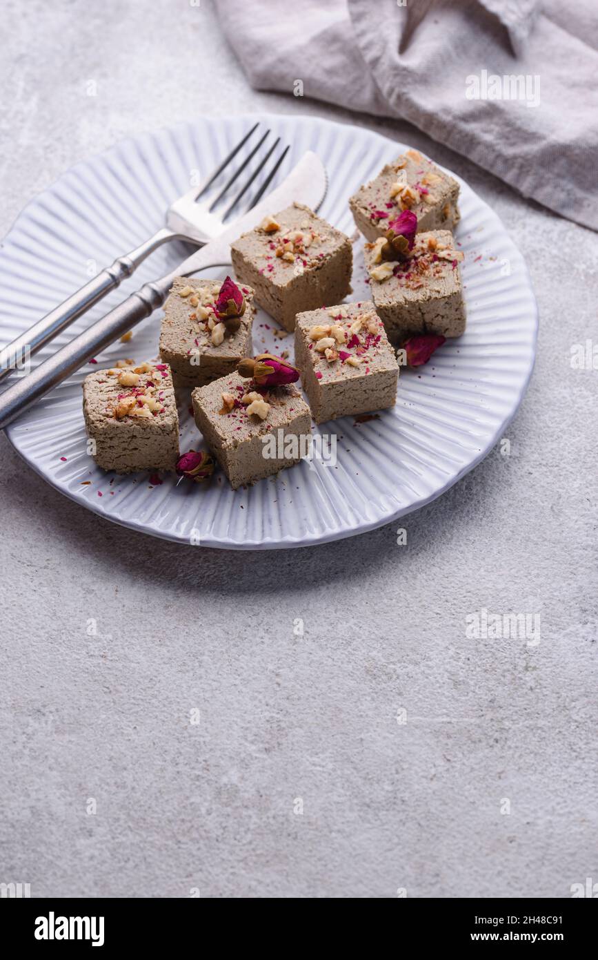 Halva with rose petal and nuts Stock Photo - Alamy