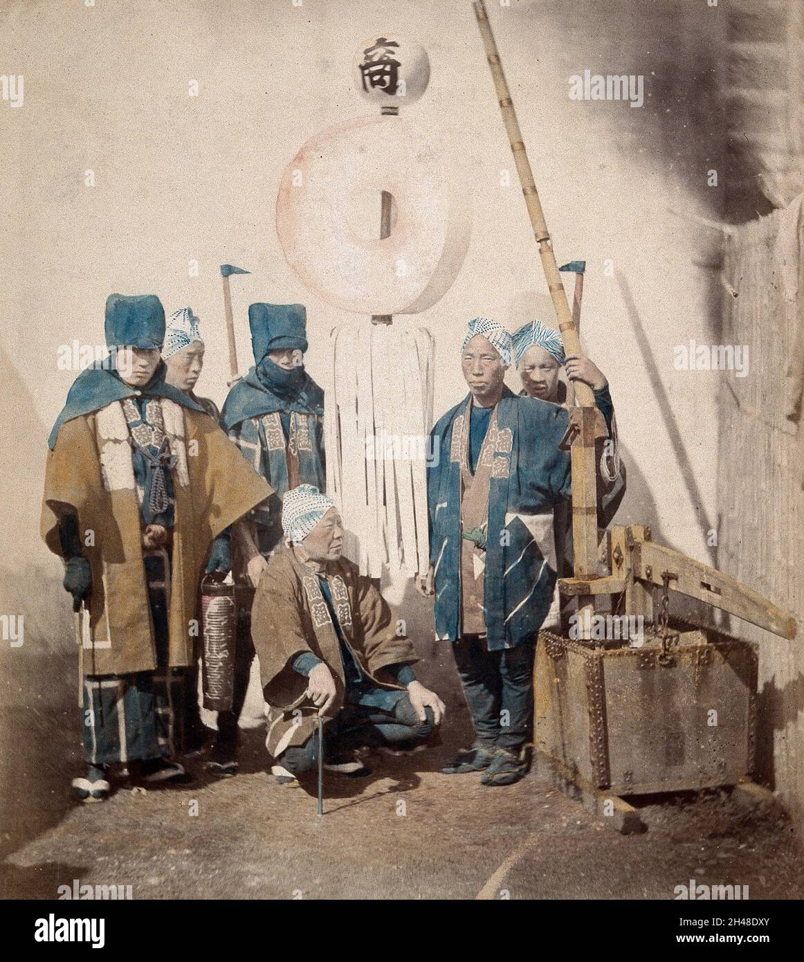 Japan: firemen in traditional dress. Coloured photograph by Felice ...