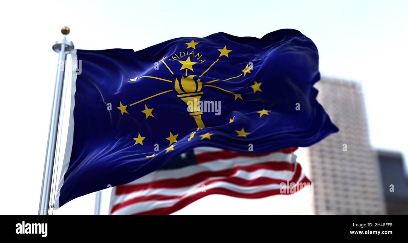 the flag of the US state of Indiana waving in the wind with the ...