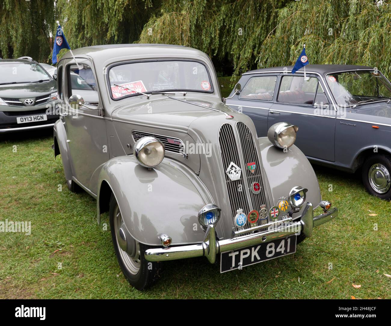 Three-quarters front view of a Green, 1953, Ford Anglia, on display in ...
