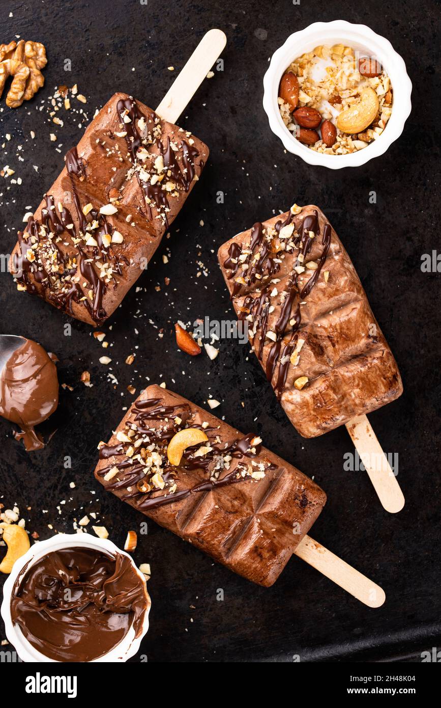 Chocolate ice cream popsicle with nut Stock Photo - Alamy