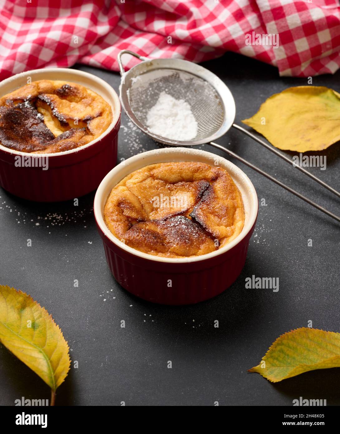 cottage cheese dessert baked in portioned round ceramic plates on a ...