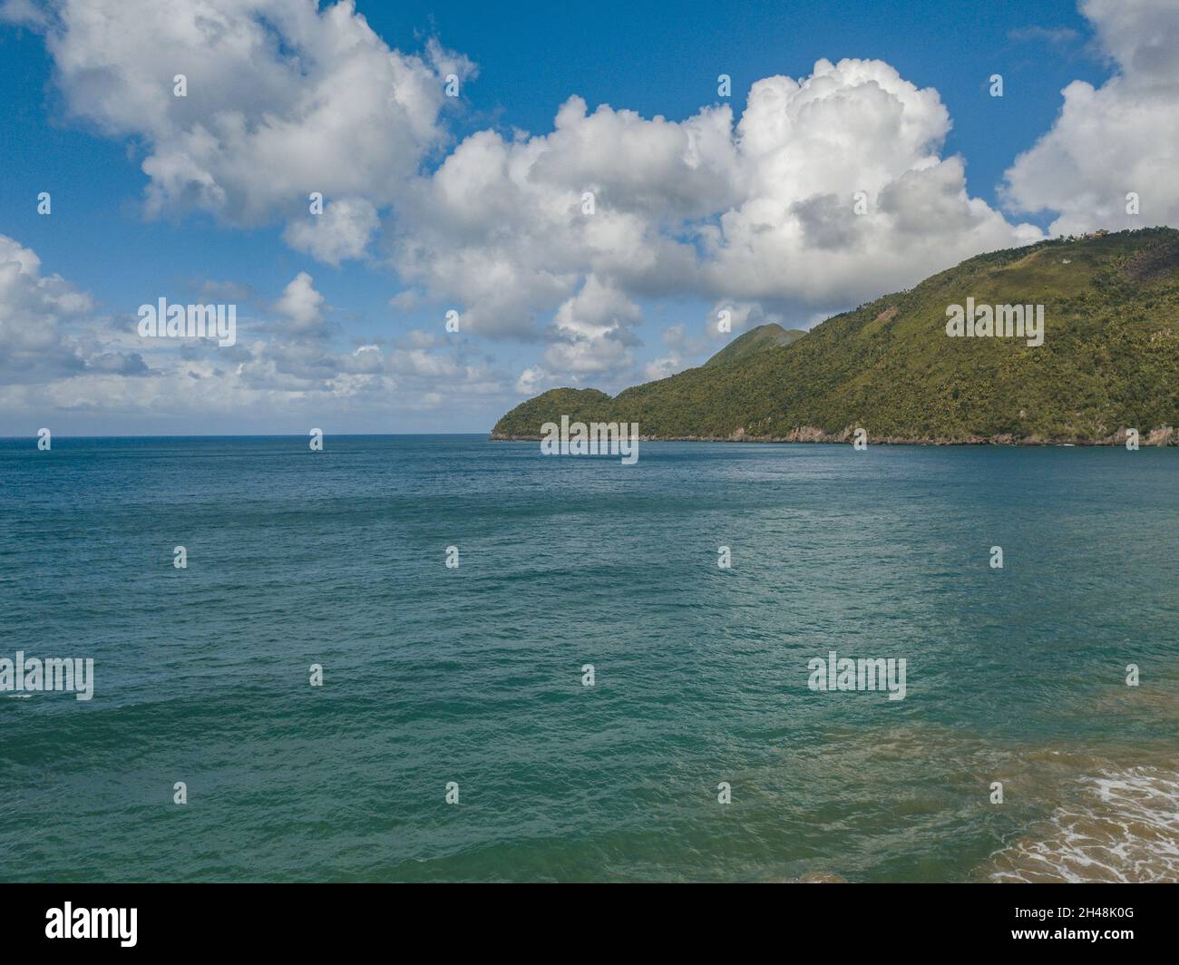 Landscape of El Valle Beach surrounded by greenery and sea in Samana ...
