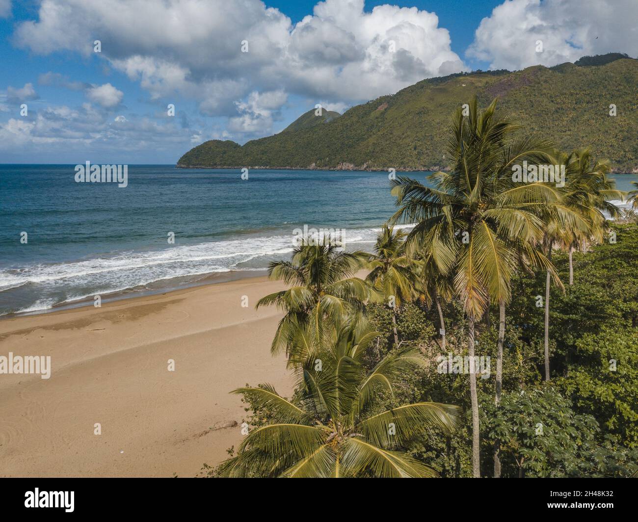 Landscape of El Valle Beach surrounded by greenery and sea in Samana ...